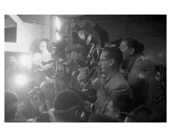 Press crowd the locker room after the 1956 World Series game at Ebbets ...